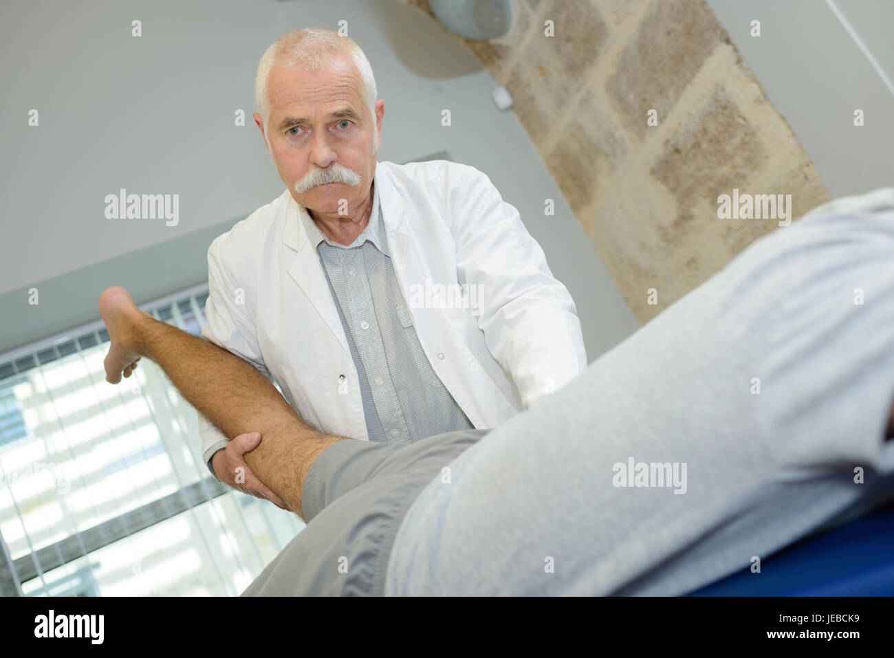 senior doing rehabilitation physiotherapy on patient Stock Photo - Alamy