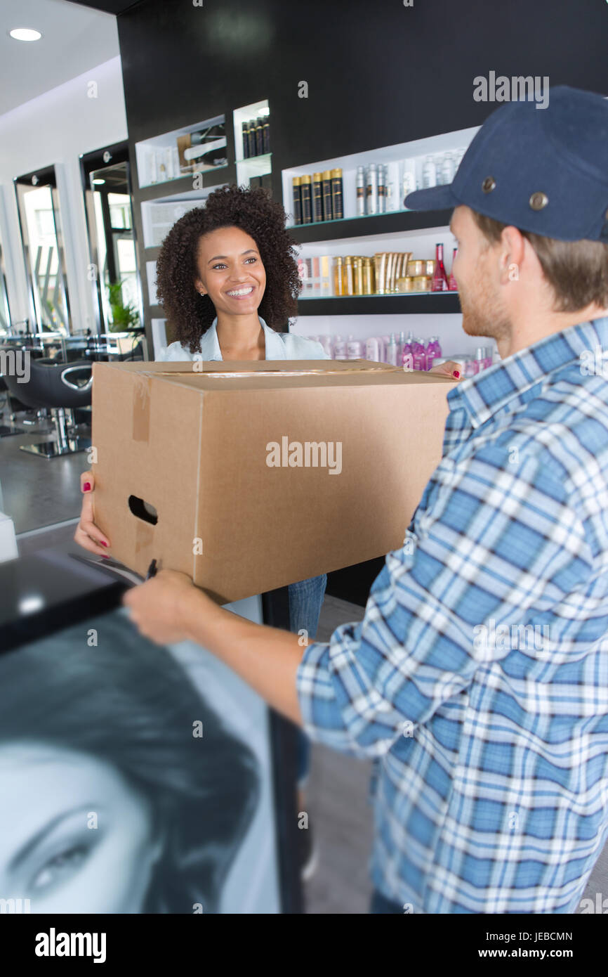woman receiving a box Stock Photo - Alamy