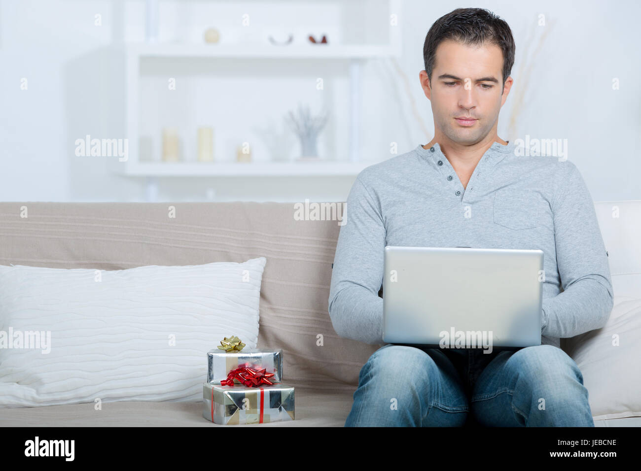 man writing a thank you email present Stock Photo - Alamy