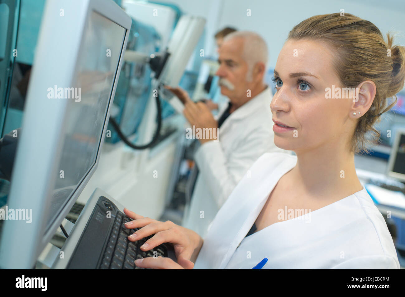 doctor looking at screen computer Stock Photo - Alamy