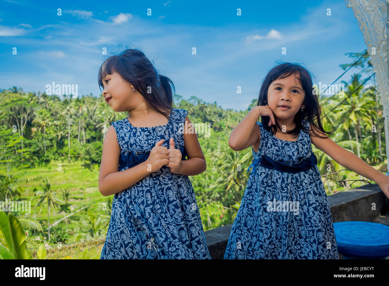 BALI, INDONESIA - APRIL 05, 2017: Two beautiful girls wearing a dress ...