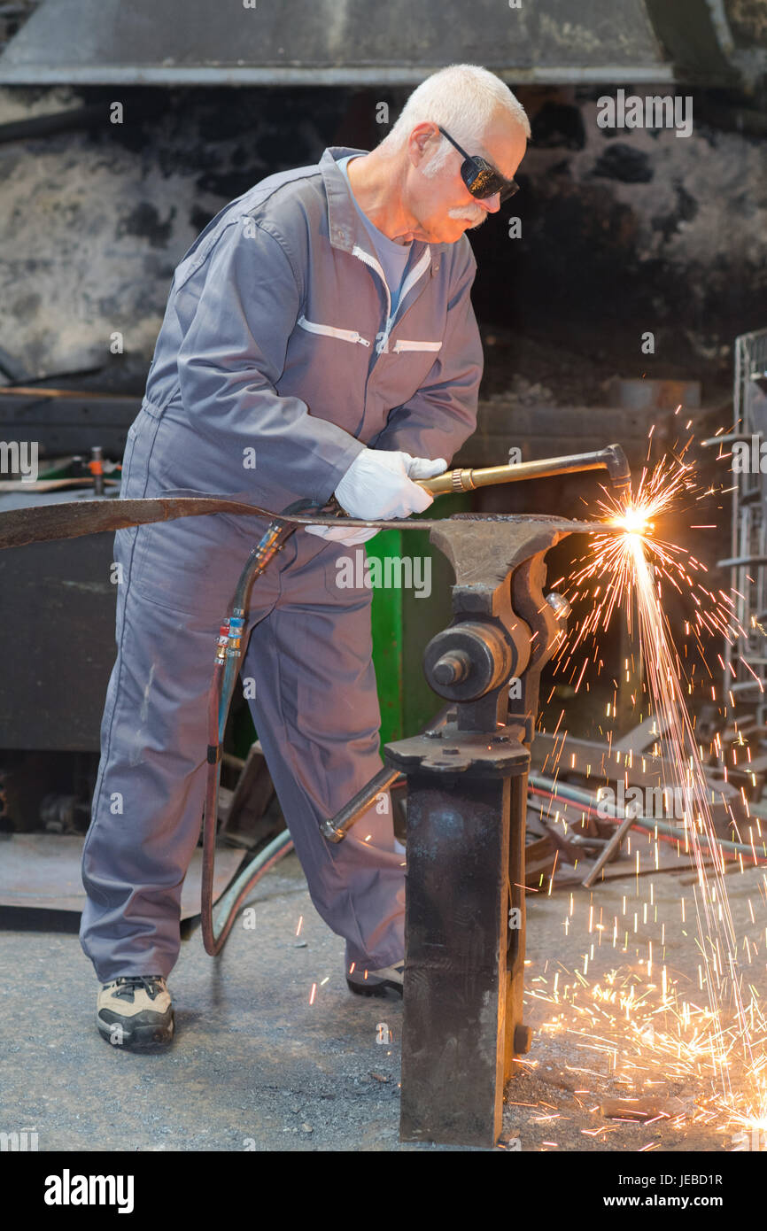 old welder perfecting his work Stock Photo - Alamy