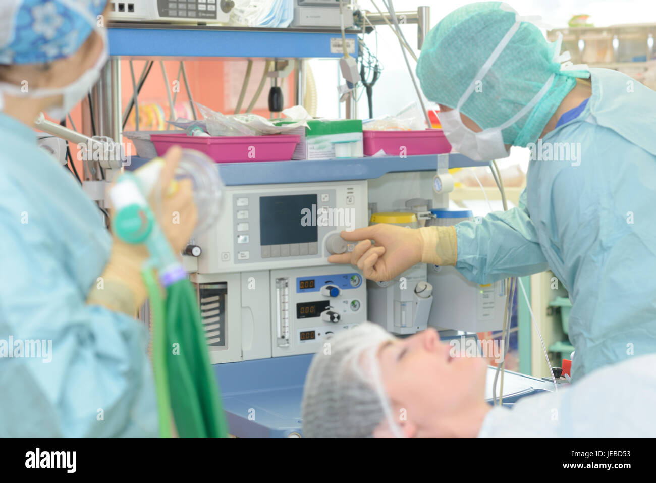 surgeons working with monitoring of patient in surgical operating room ...