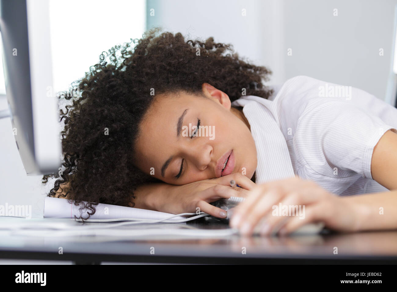 young woman sleeping on laptop in the workplace Stock Photo - Alamy