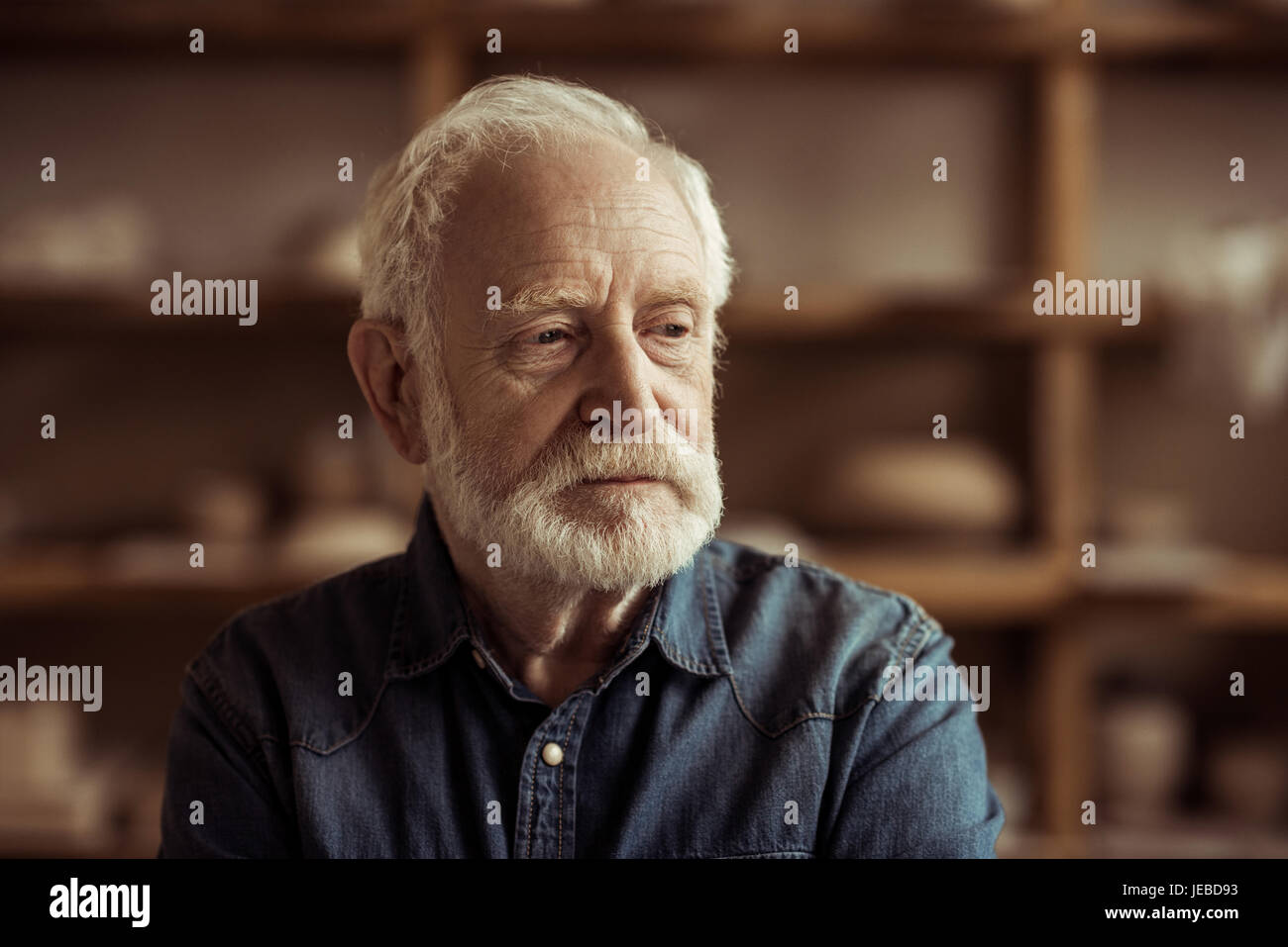 Portrait of senior potter at workshop Stock Photo - Alamy
