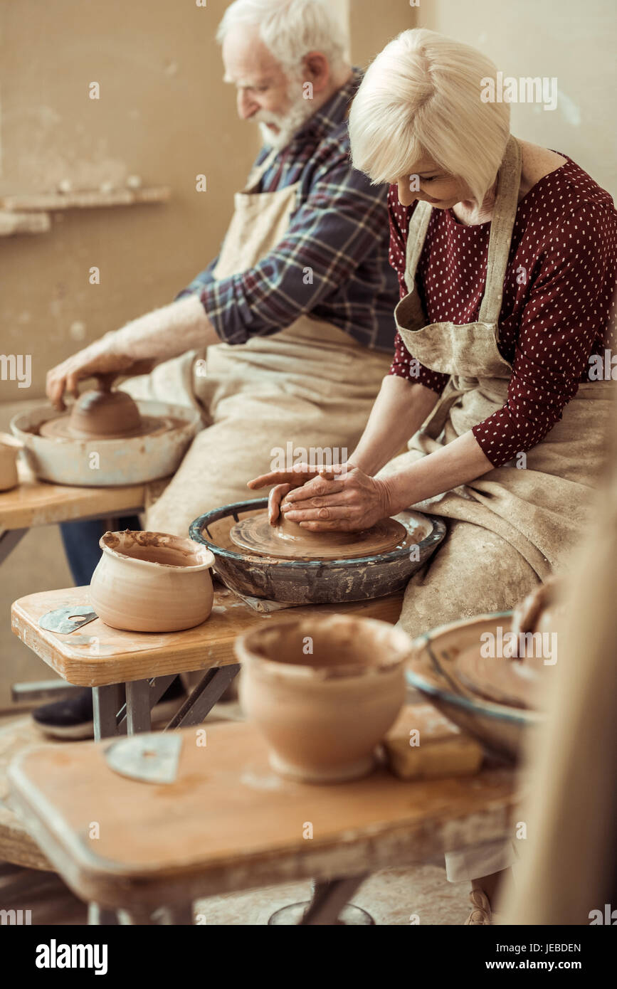 Grandmother and grandfather making pottery at workshop Stock Photo - Alamy