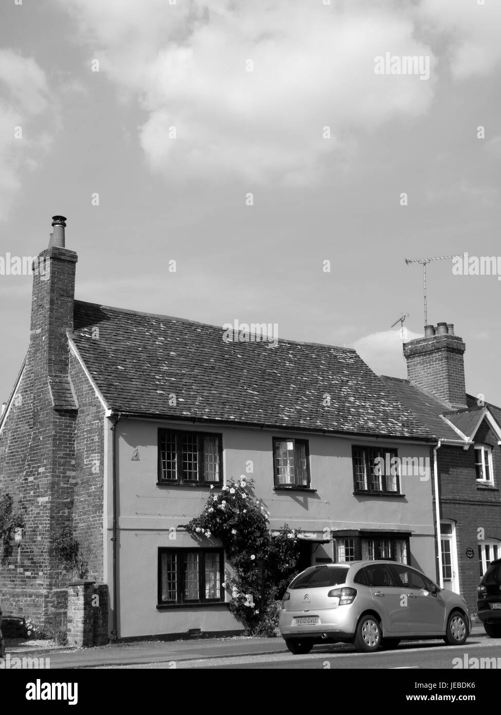 Car on residential road Black and White Stock Photos & Images - Alamy