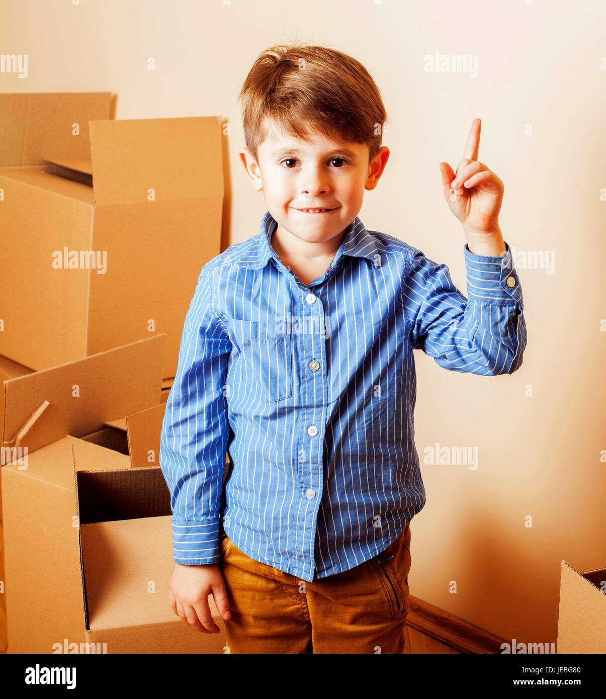 little cute boy in empty room, remoove to new house. home alone Stock ...