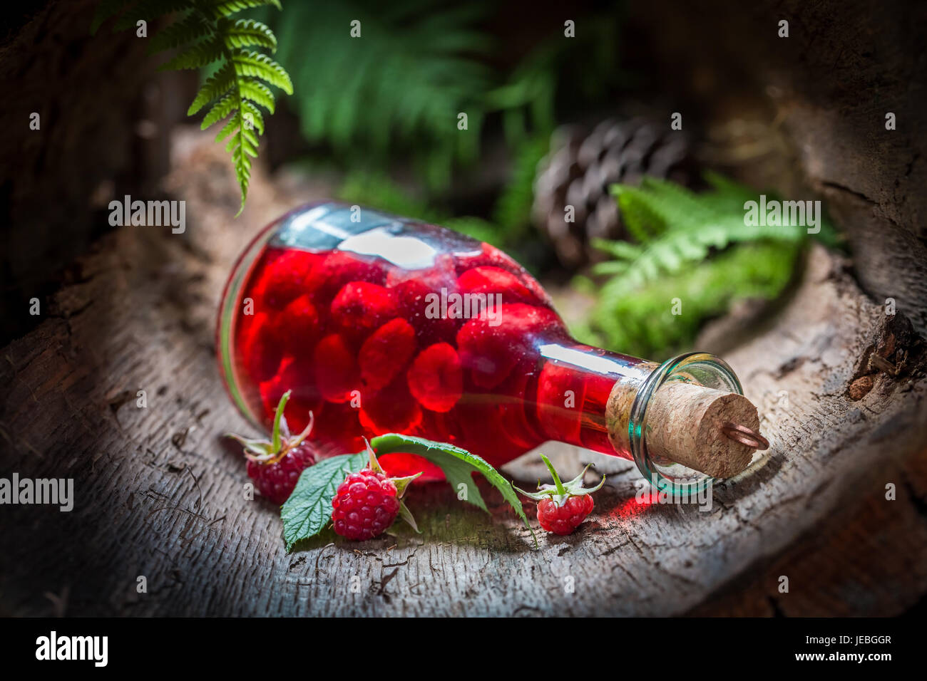 Closeup of raspberries liqueur made of fruits and alcohol Stock Photo ...