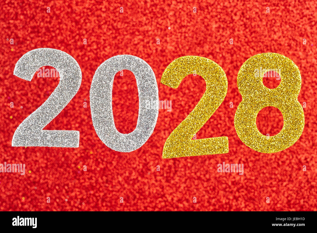 Number two thousand and twenty-eight over a red background. Anniversary ...