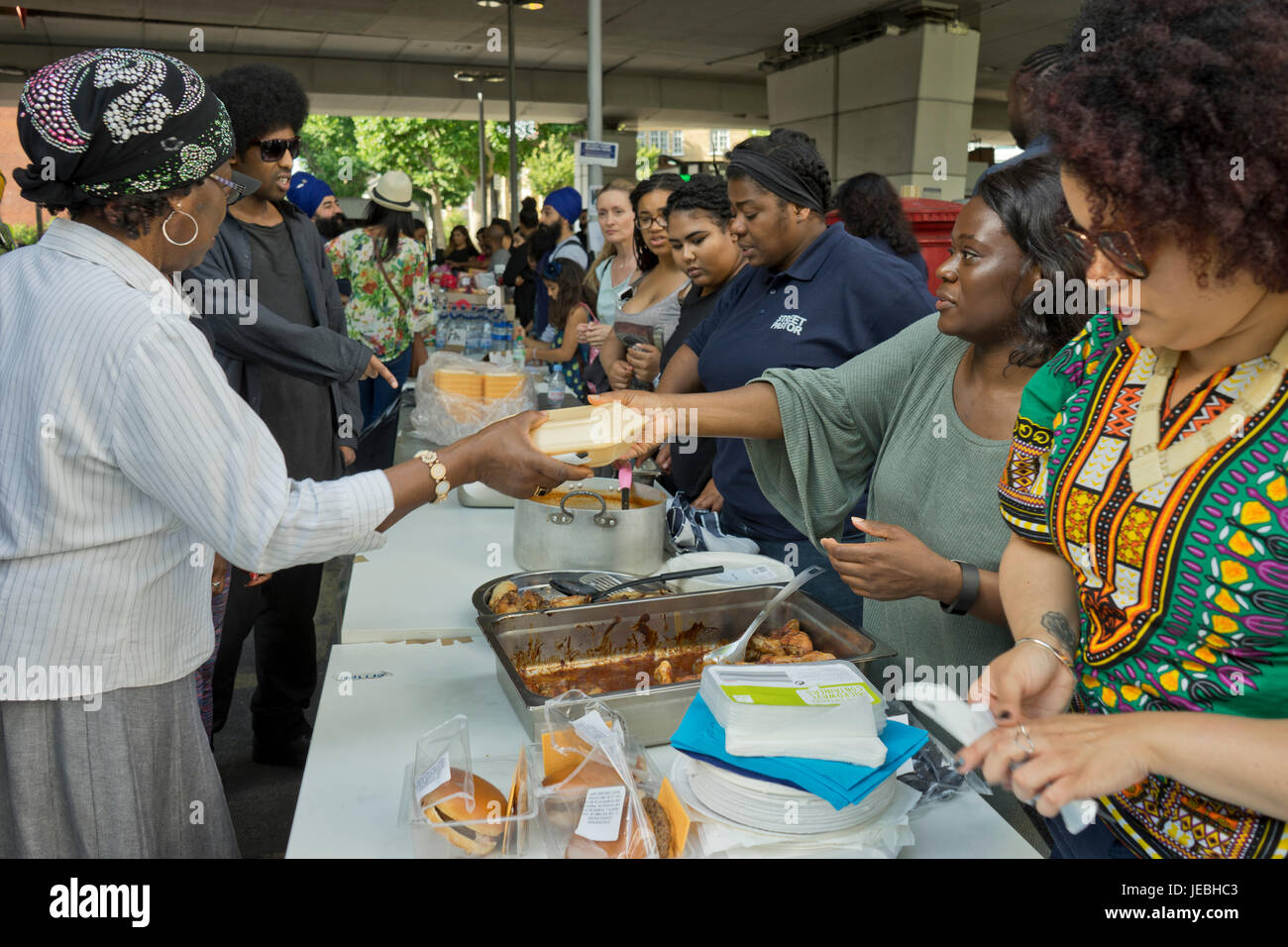Community volunteers giving food to victims of the fire disaster at the ...
