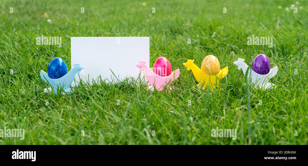 Colorful Easter eggs in egg cups with copy space Stock Photo - Alamy