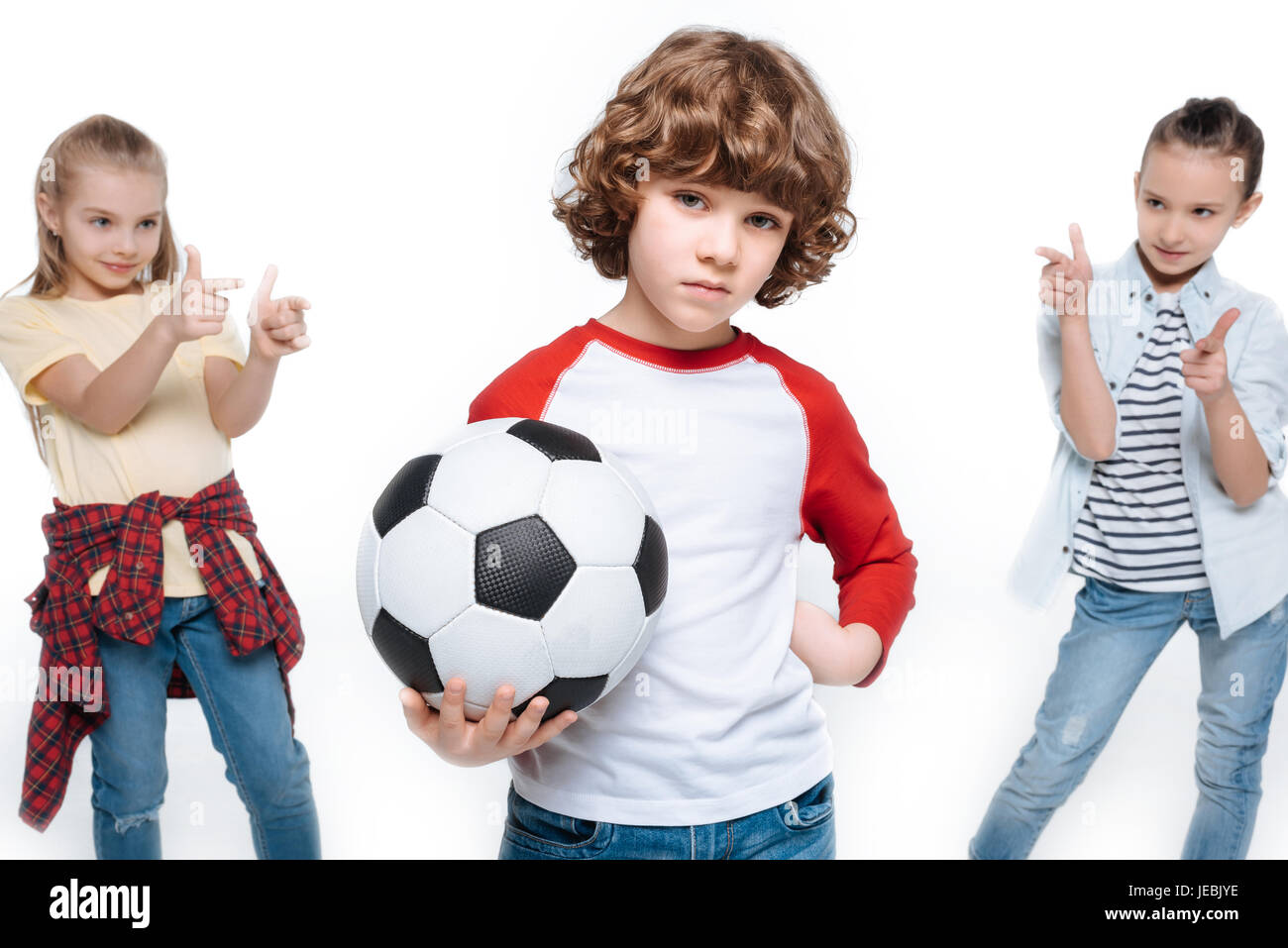 Group of friends posing with soccer ball isolated on white, children ...
