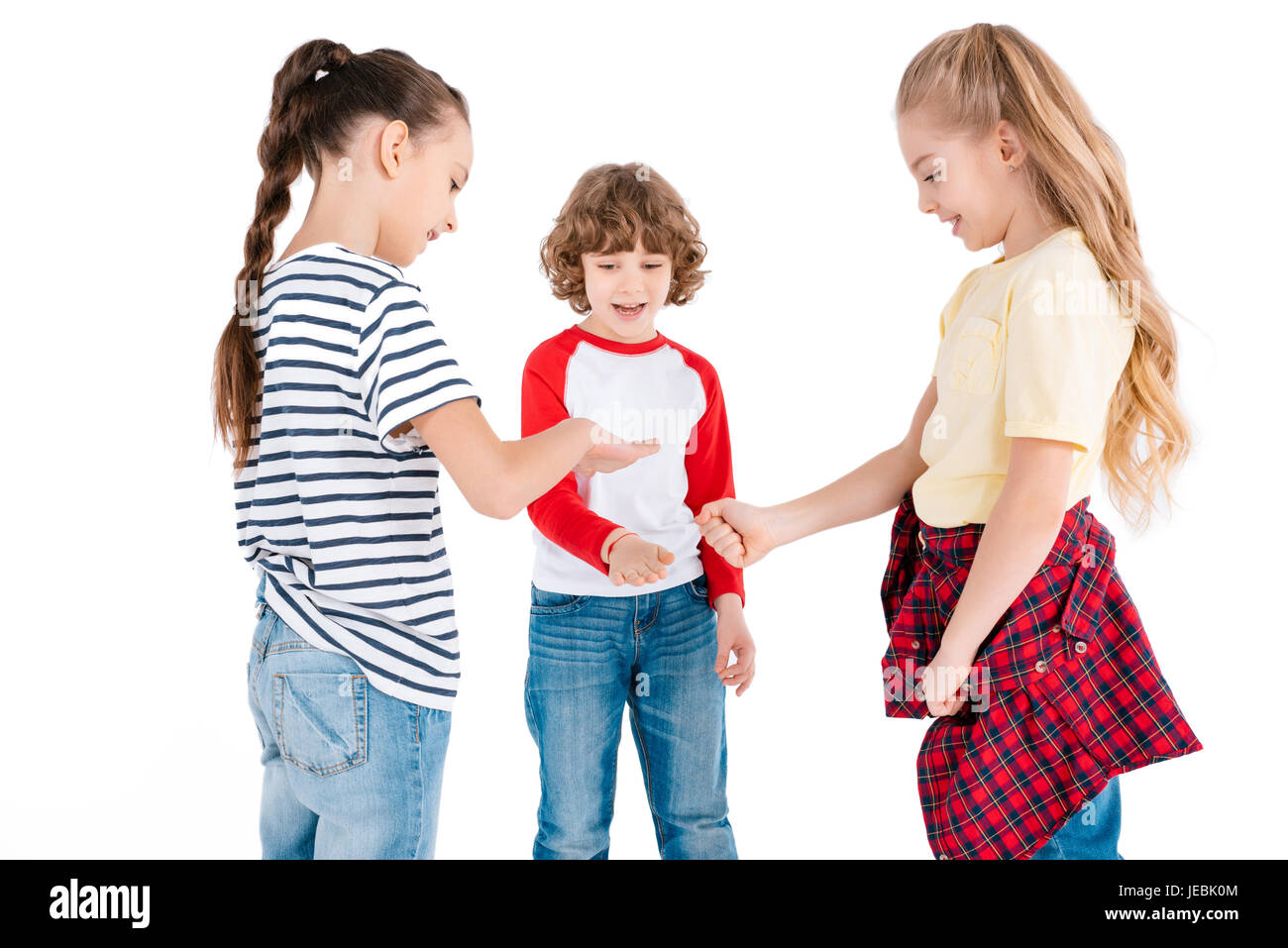 Children playing in rock-paper-scissors game isolated on white Stock ...