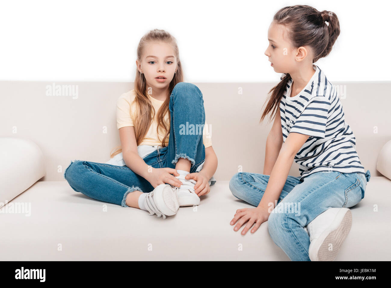 Beautiful girls sitting on couch hi-res stock photography and images ...