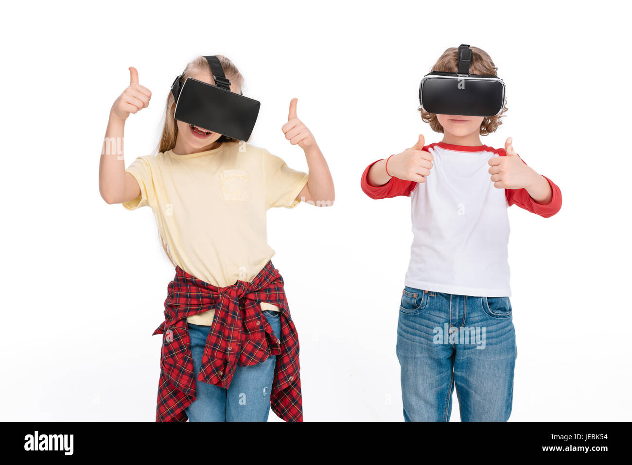 Boy and girl have fun while using virtual reality headsets isolated ...