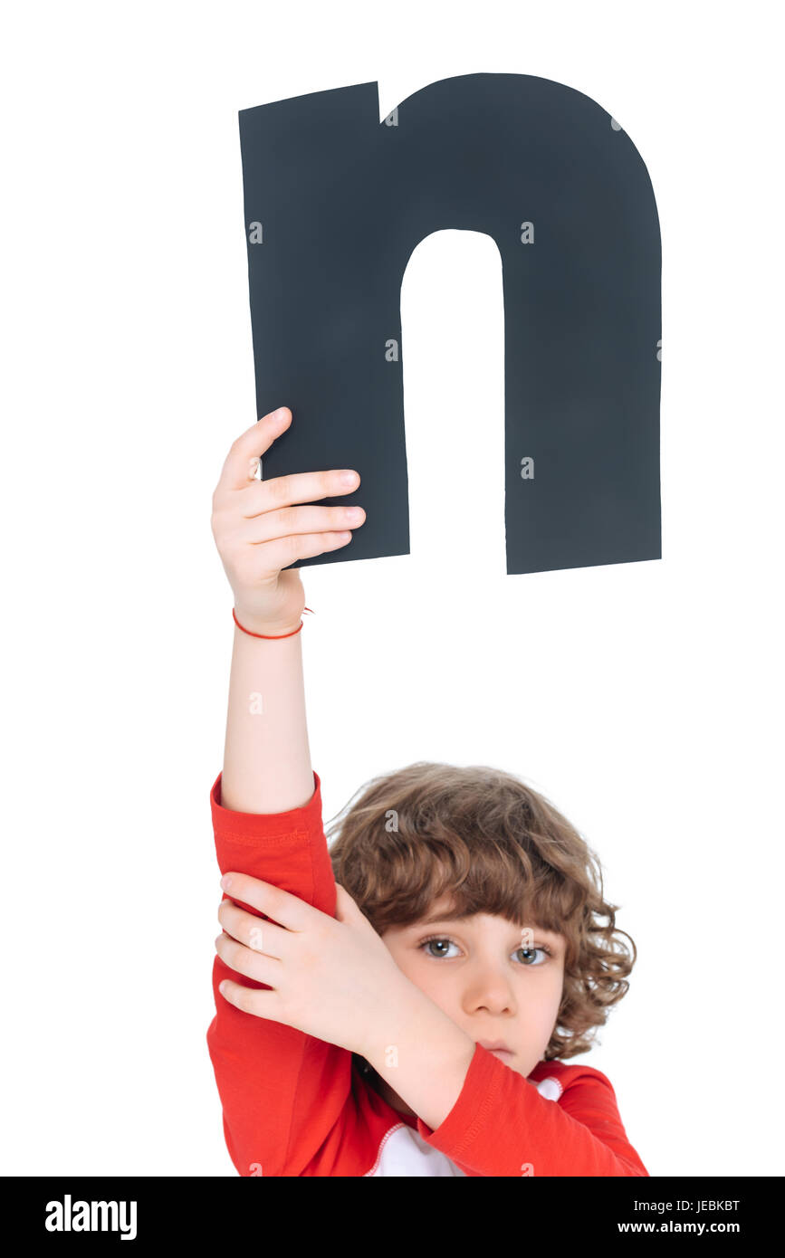 Boy holding alphabet letter over head isolated, alphabet letters ...