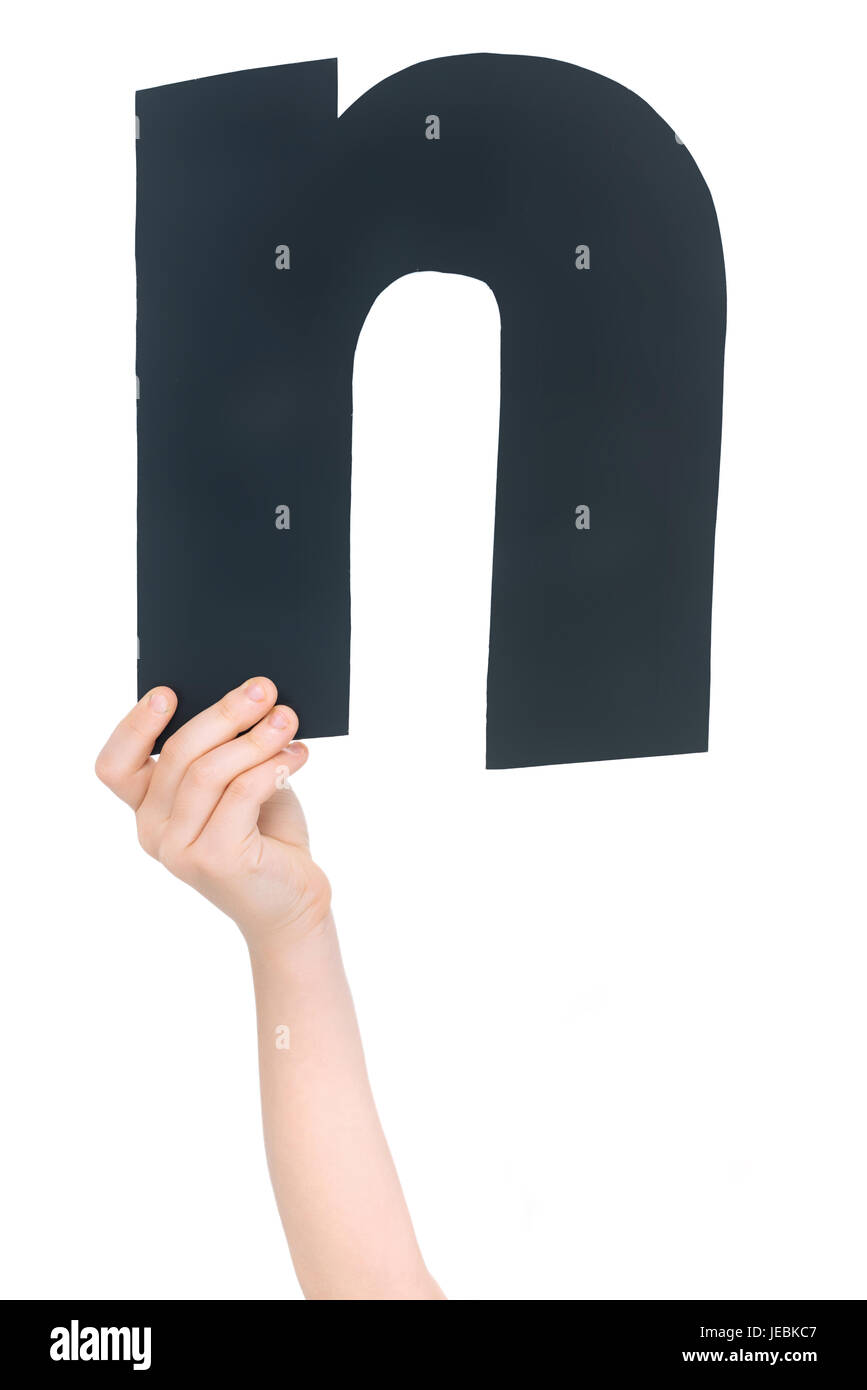 Kid holding colorful alphabet letter N in hand isolated, alphabet ...