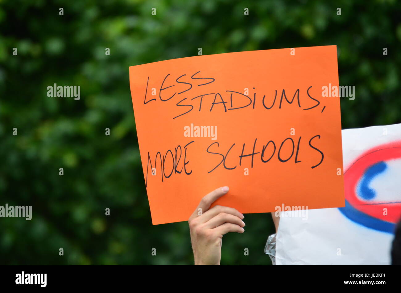 Less Stadiums, More Schools Handwritten Sign of Protest Stock Photo - Alamy