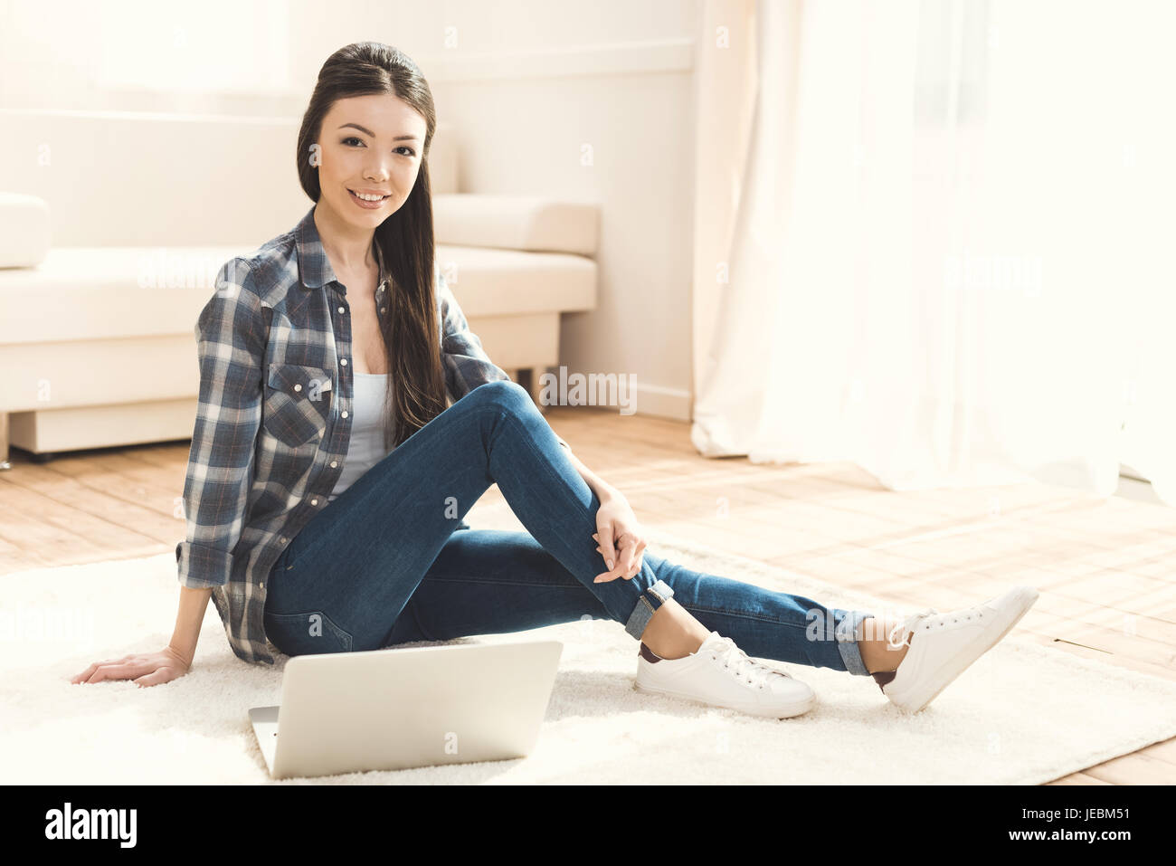Woman sitting on white hi-res stock photography and images - Alamy