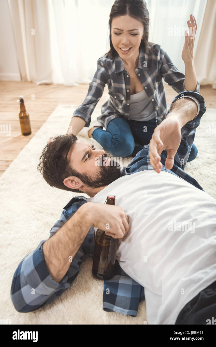 Man on floor drunk home hi-res stock photography and images - Alamy