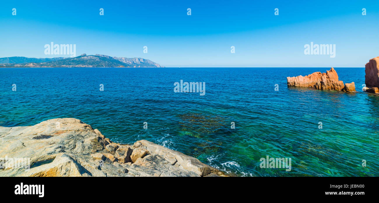 red rocks in Rocce Rosse beach, Sardinia Stock Photo - Alamy