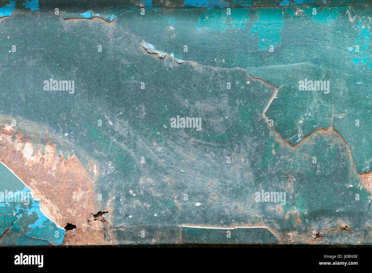 Colorful scratched painted old and abadoned rusty on car chassis metal ...