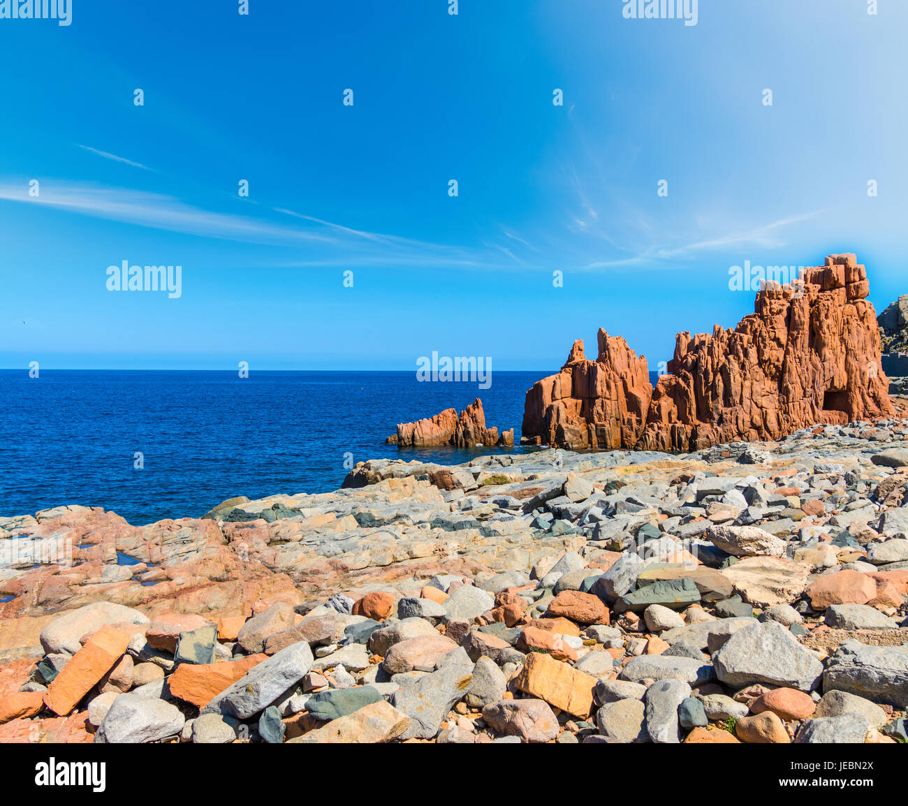 red rocks in Rocce Rosse beach, Sardinia Stock Photo - Alamy