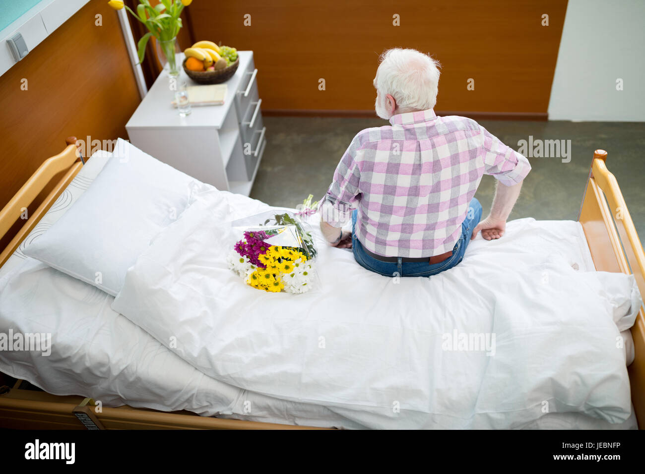 Back view patient man hospital bed hi-res stock photography and images ...