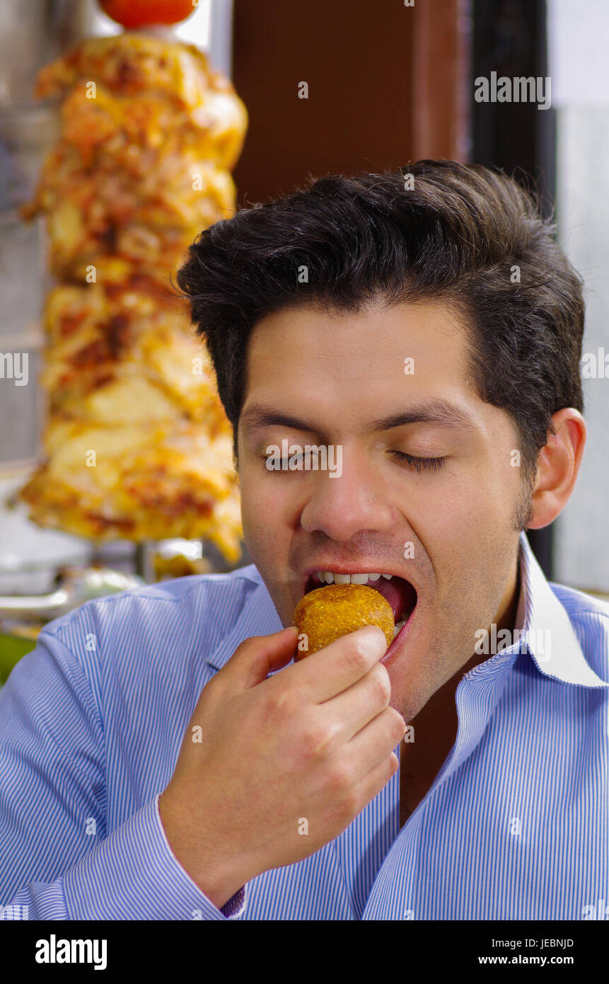 Handsome man eating a delicious turkish food Stock Photo - Alamy