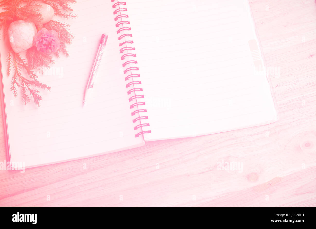 Vintage notebook with pink color on wooden floor Stock Photo - Alamy