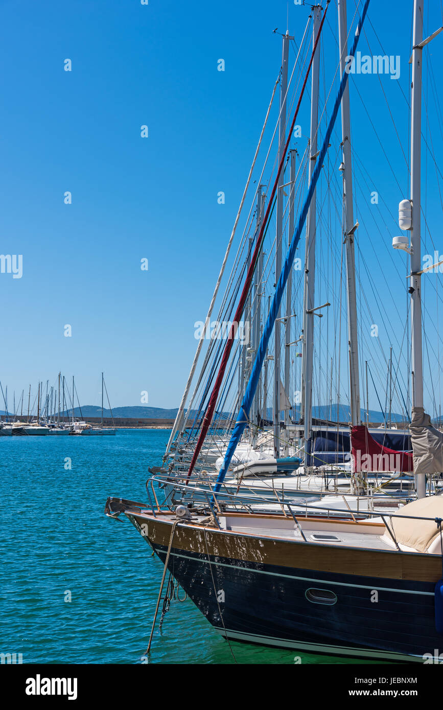 Boat masts in Alghero harbor, Sardinia Stock Photo - Alamy