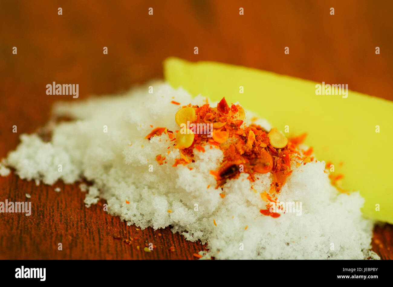Close up shot of fresh sliced mango served with salt and chilli powder ...