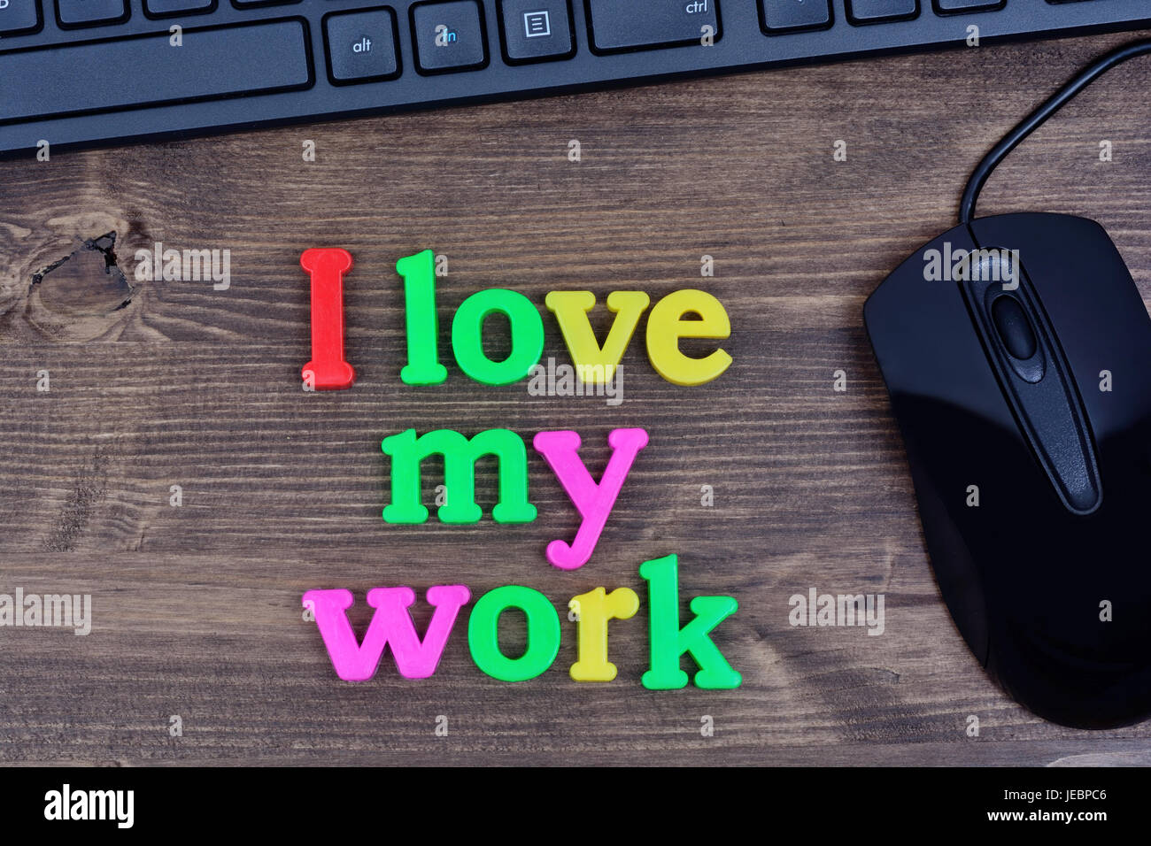 I love my work words on wooden table Stock Photo - Alamy