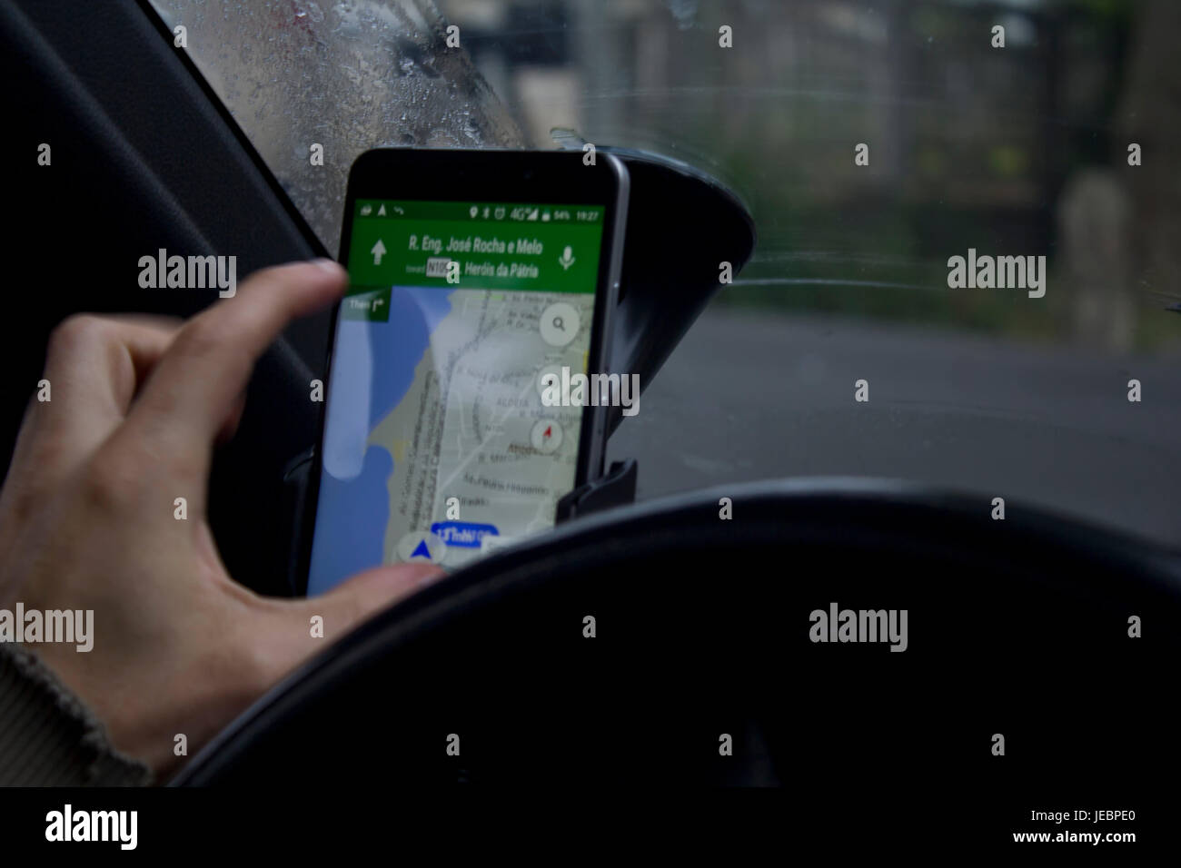 Man using google maps on smartphone Stock Photo - Alamy