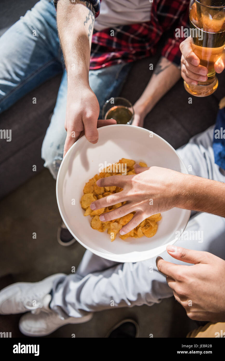 Crisps hands hi-res stock photography and images - Alamy