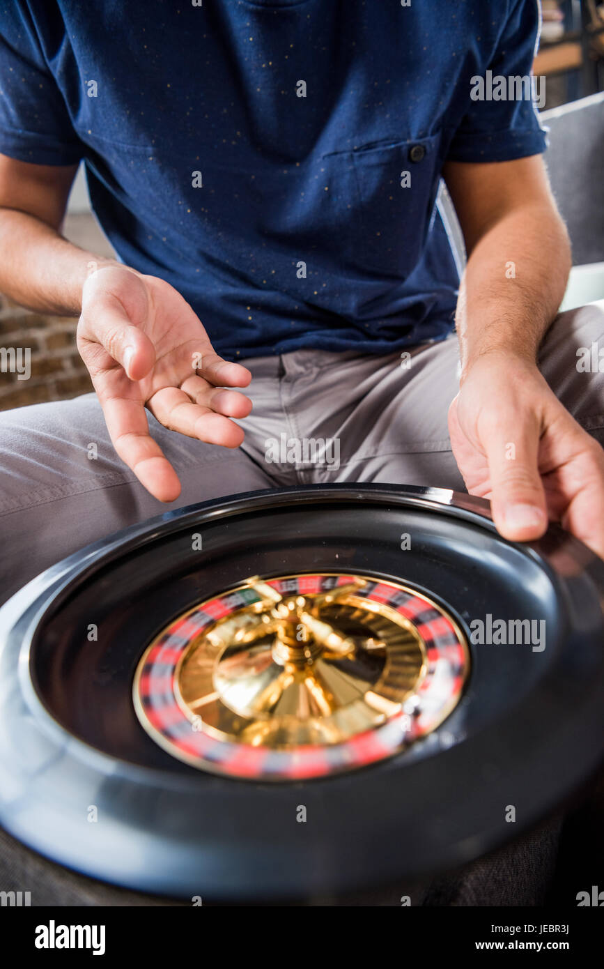 young man with roulette wheel. young people having fun concept Stock ...
