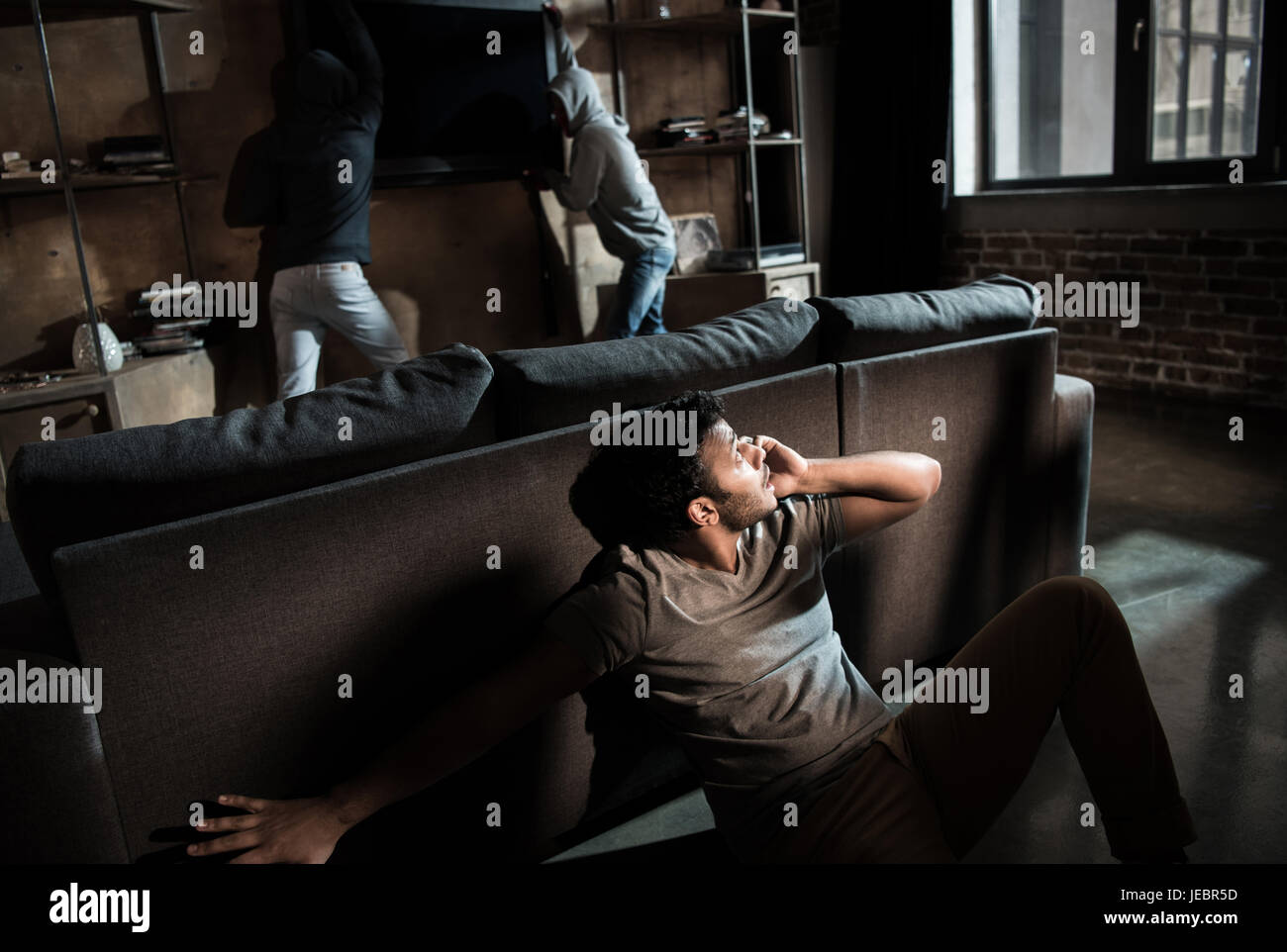Hiding behind the sofa hi-res stock photography and images - Alamy
