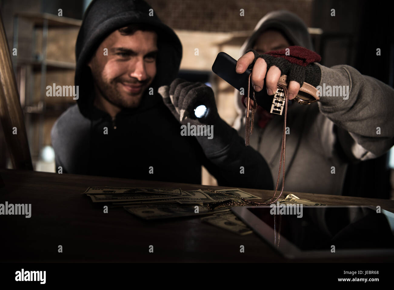 Two robbers stealing money and valuables, house robbery scene Stock ...