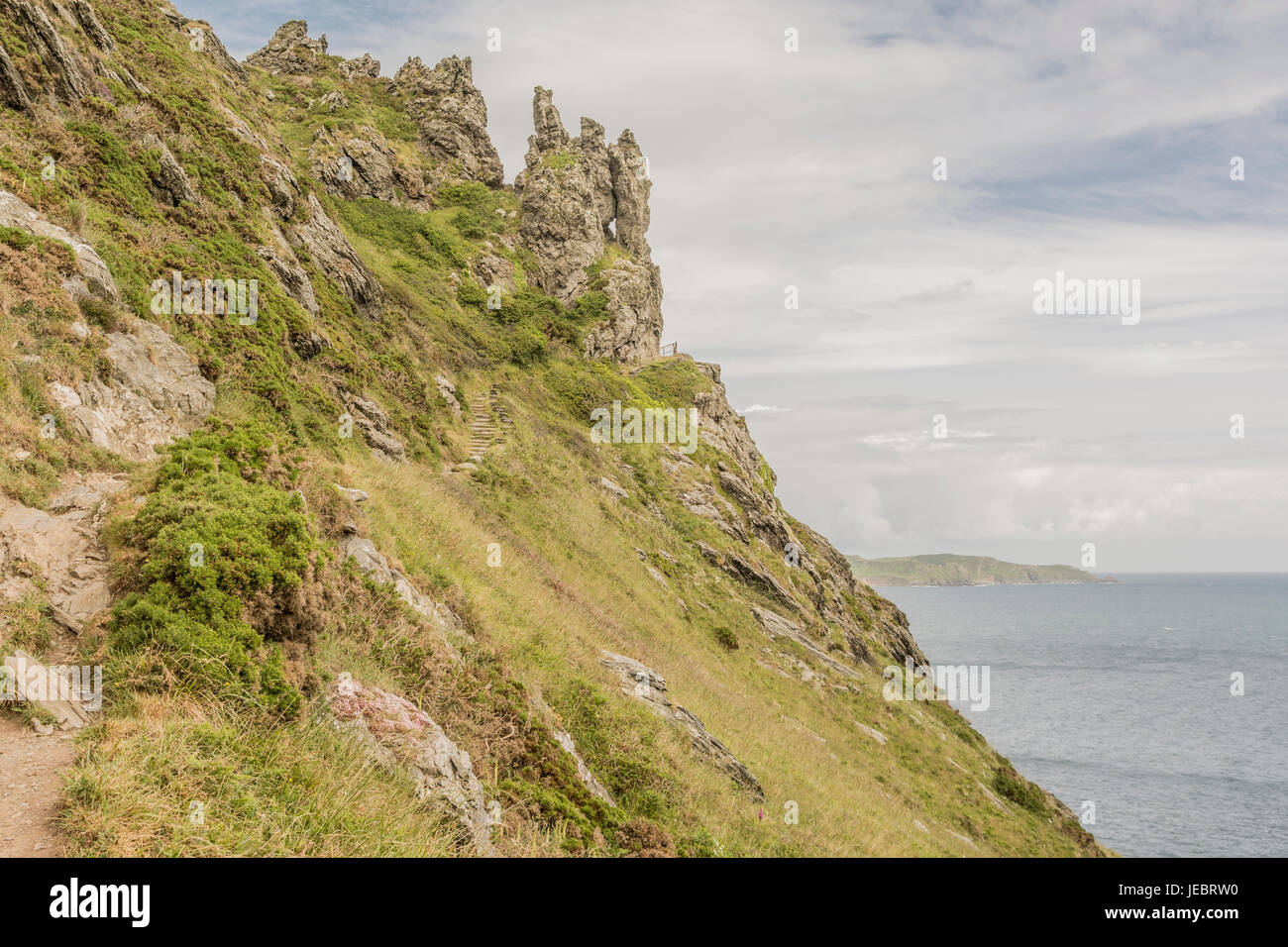 The South West Coast Path climbing up to Sharp Tor, Devon Stock Photo ...