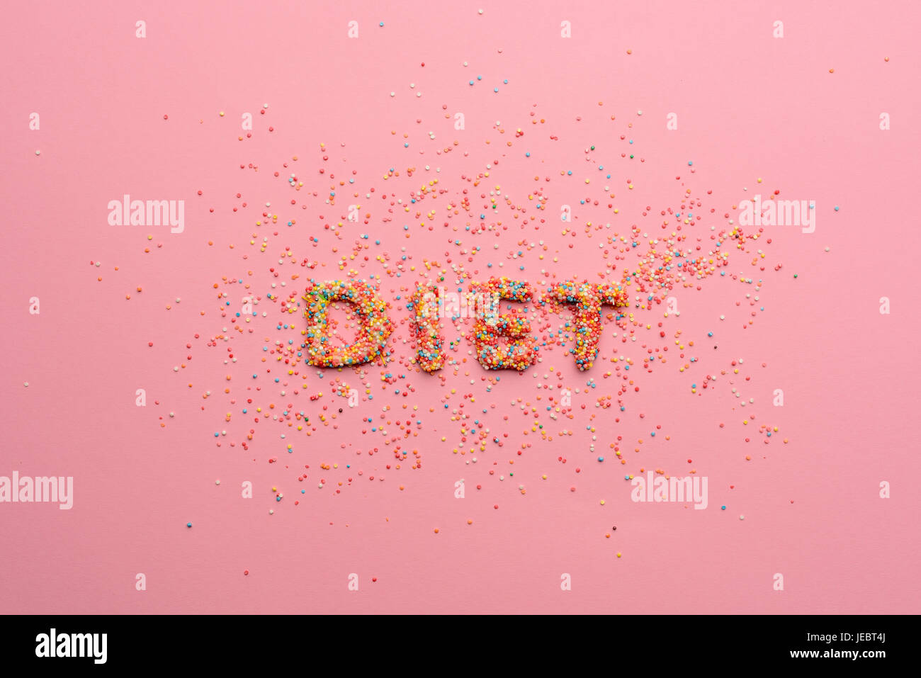 Close-up view of word diet made from sweets isolated on pink, healthy ...