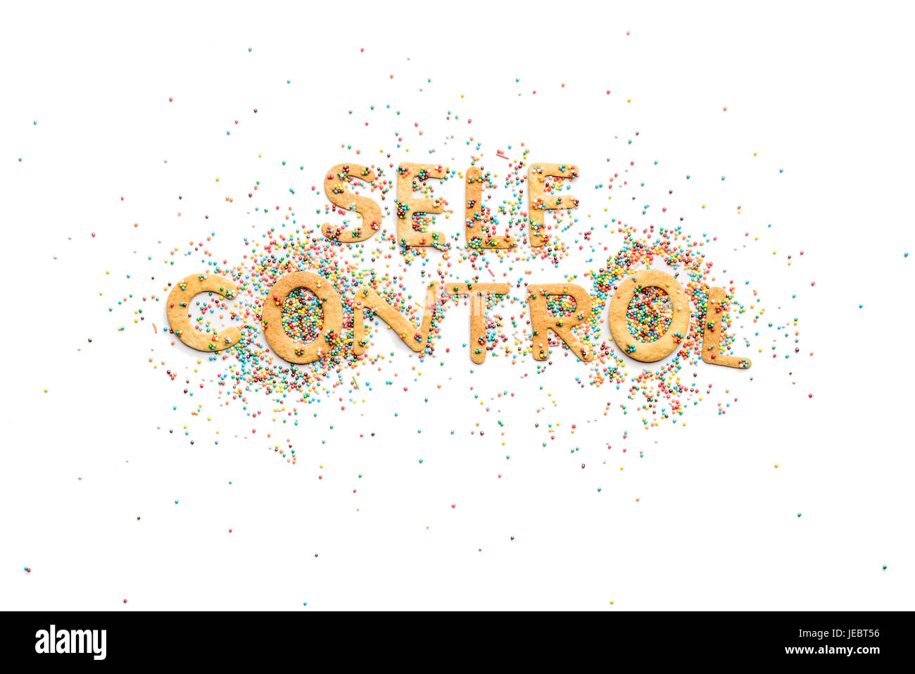 Top view of self control lettering made from sweets isolated on white ...