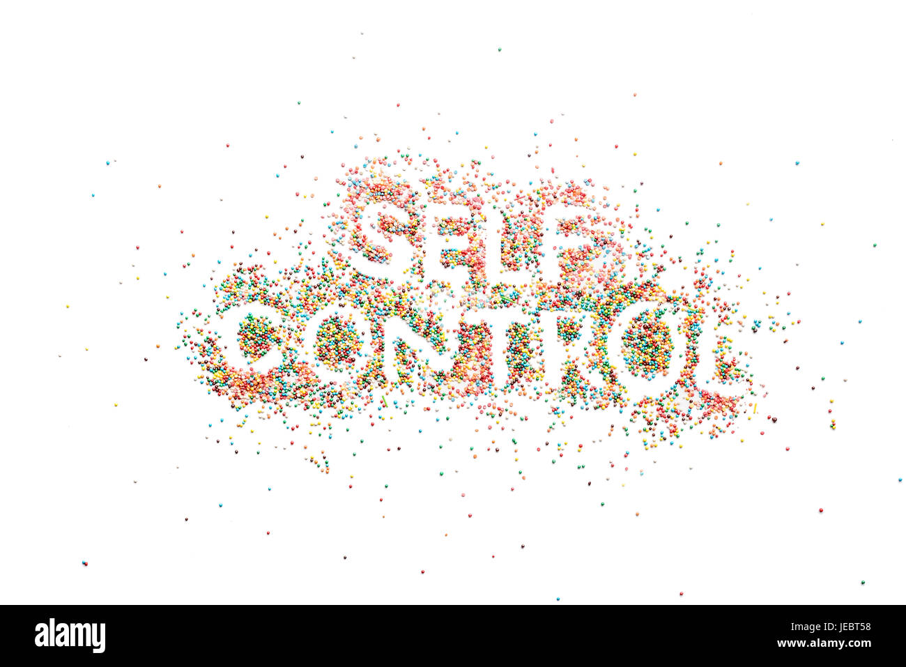 Top view of self control lettering made from sweets isolated on white ...