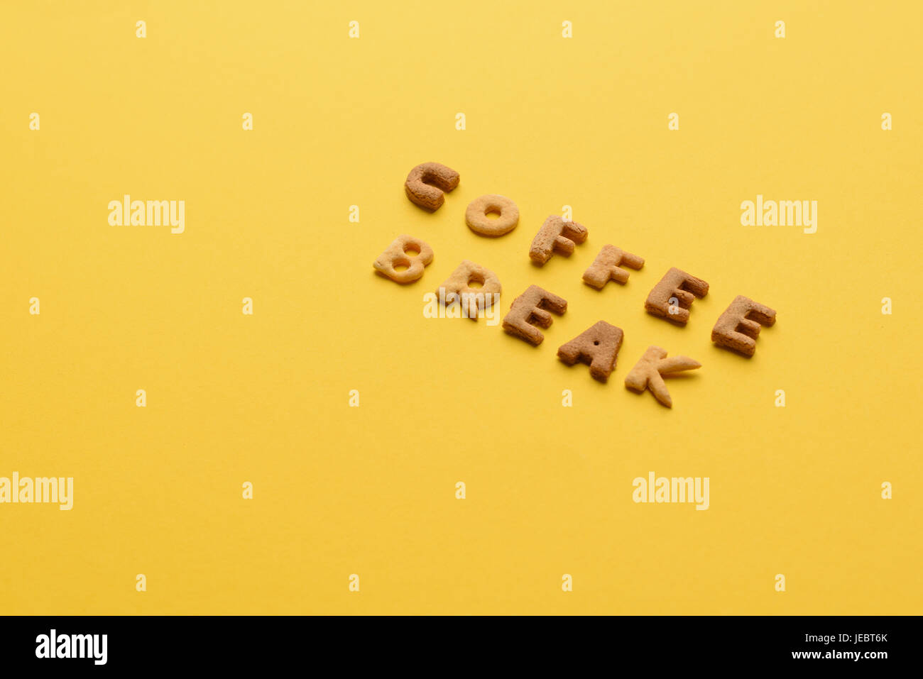 coffee break lettering made of crisps isolated on orange Stock Photo ...