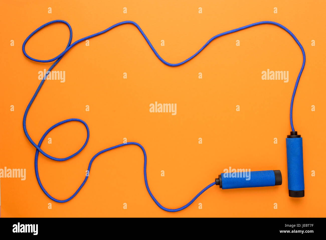 top view of sports jumping rope isolated on orange, sport background ...