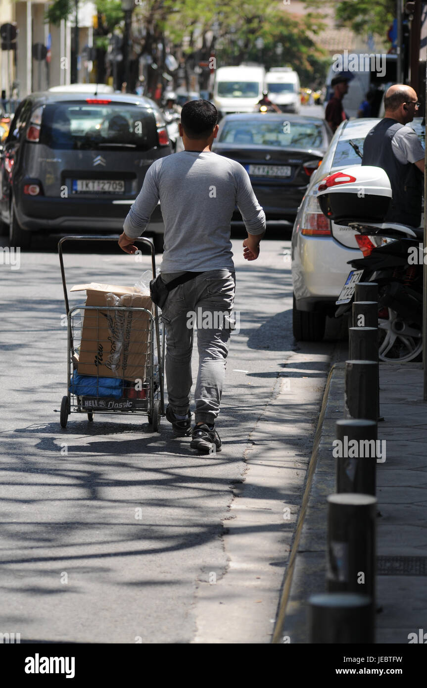 Poor and homeless migrants try to earn their living in the streets of ...