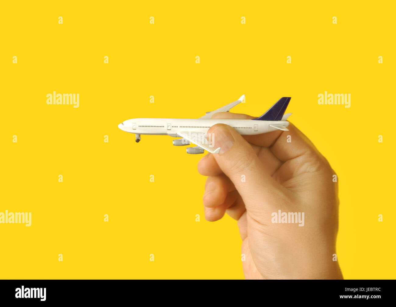 Hand, model airplane Stock Photo - Alamy