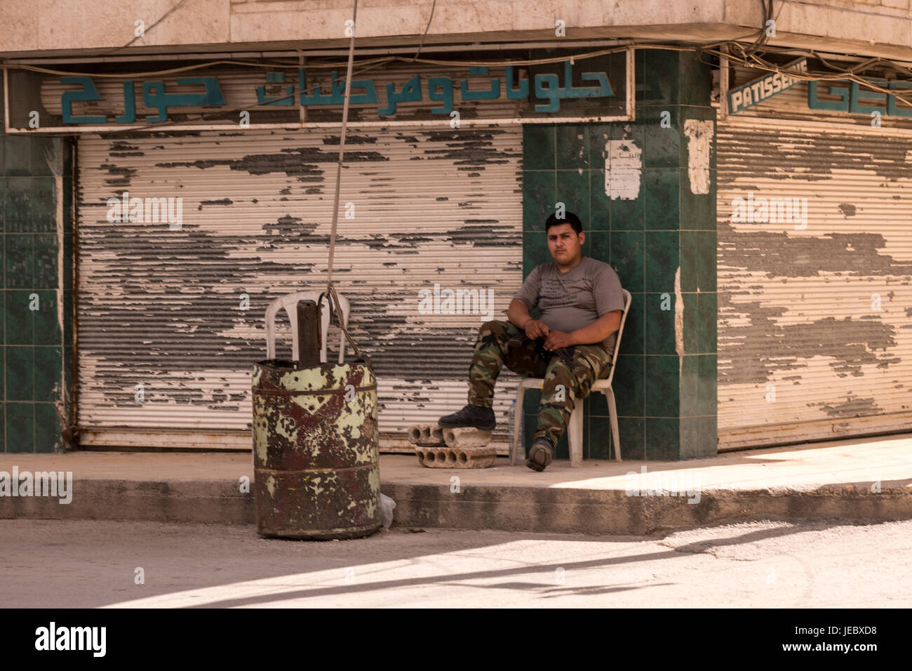 Soldier guarding corner in Syrian Army controlled Malkieh, Syria Stock ...
