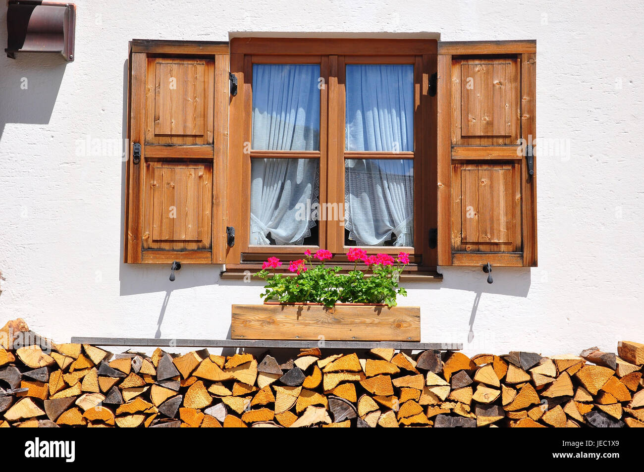 House facade, detail, window, pile of wood, alpine Stock Photo - Alamy