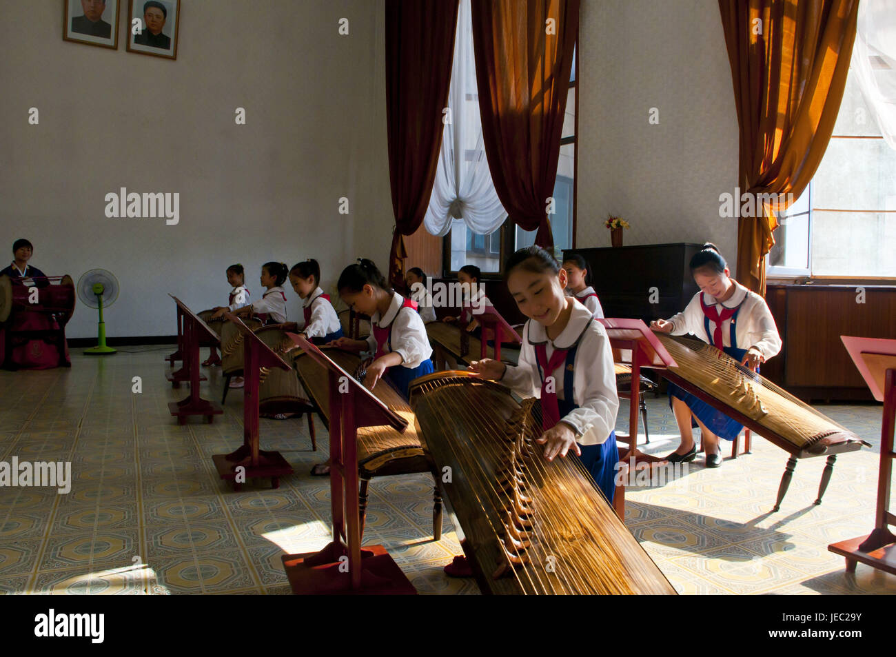 Selected children make music in the child palace hi-res stock ...